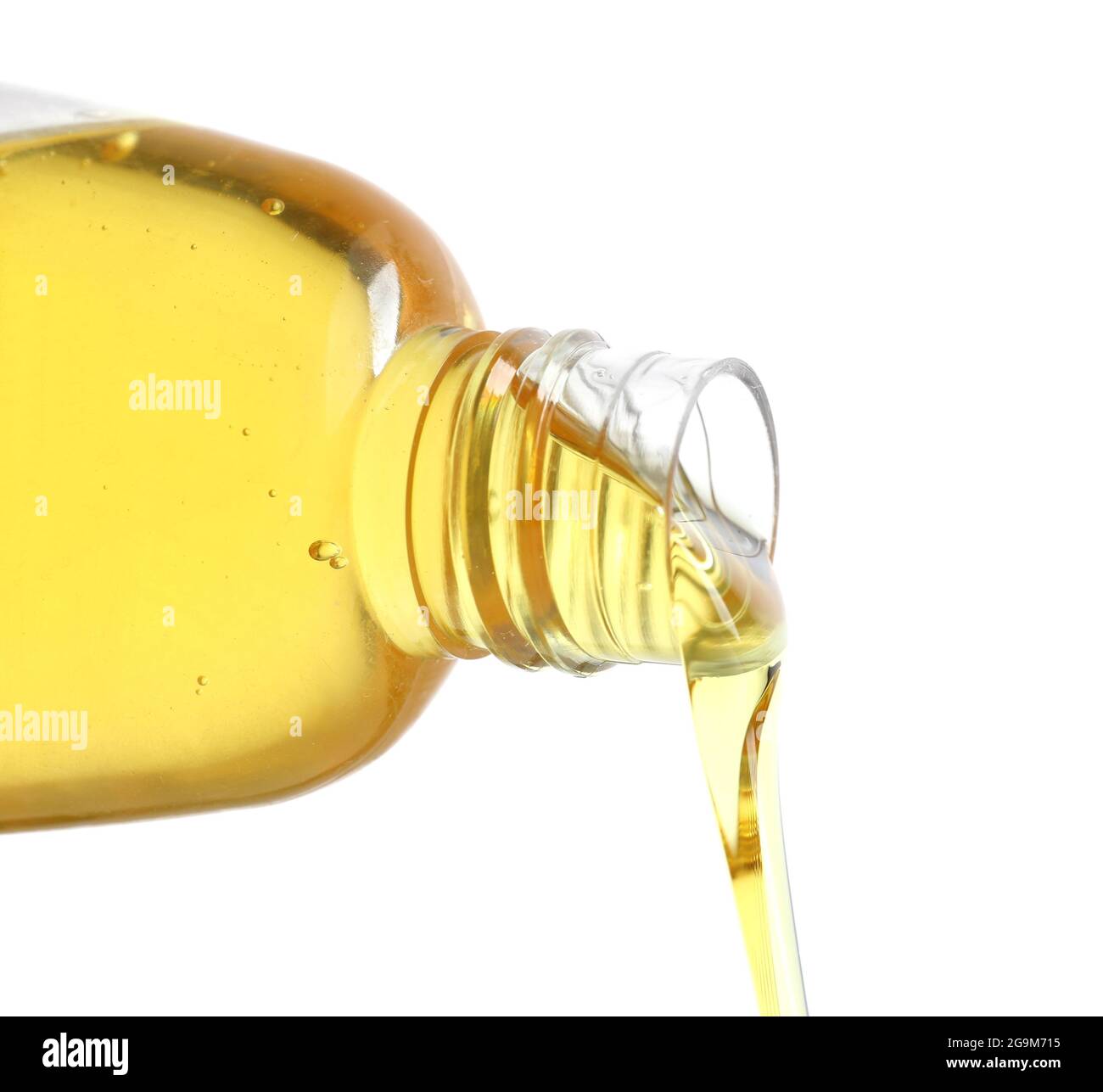 Cosmetic liquid pouring from bottle isolated on white Stock Photo - Alamy