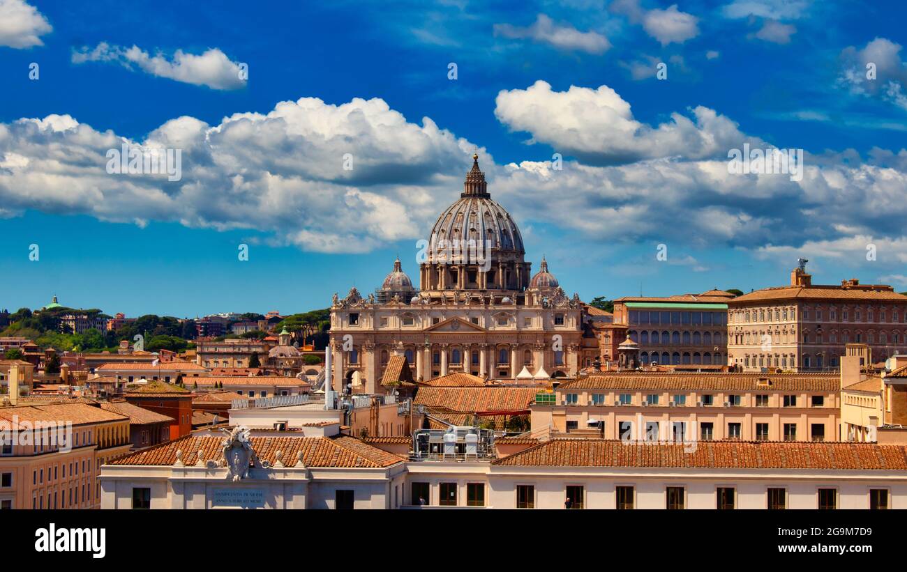 View of St. Peter's Basilica in the Vatican, over the roofs of Rome ...