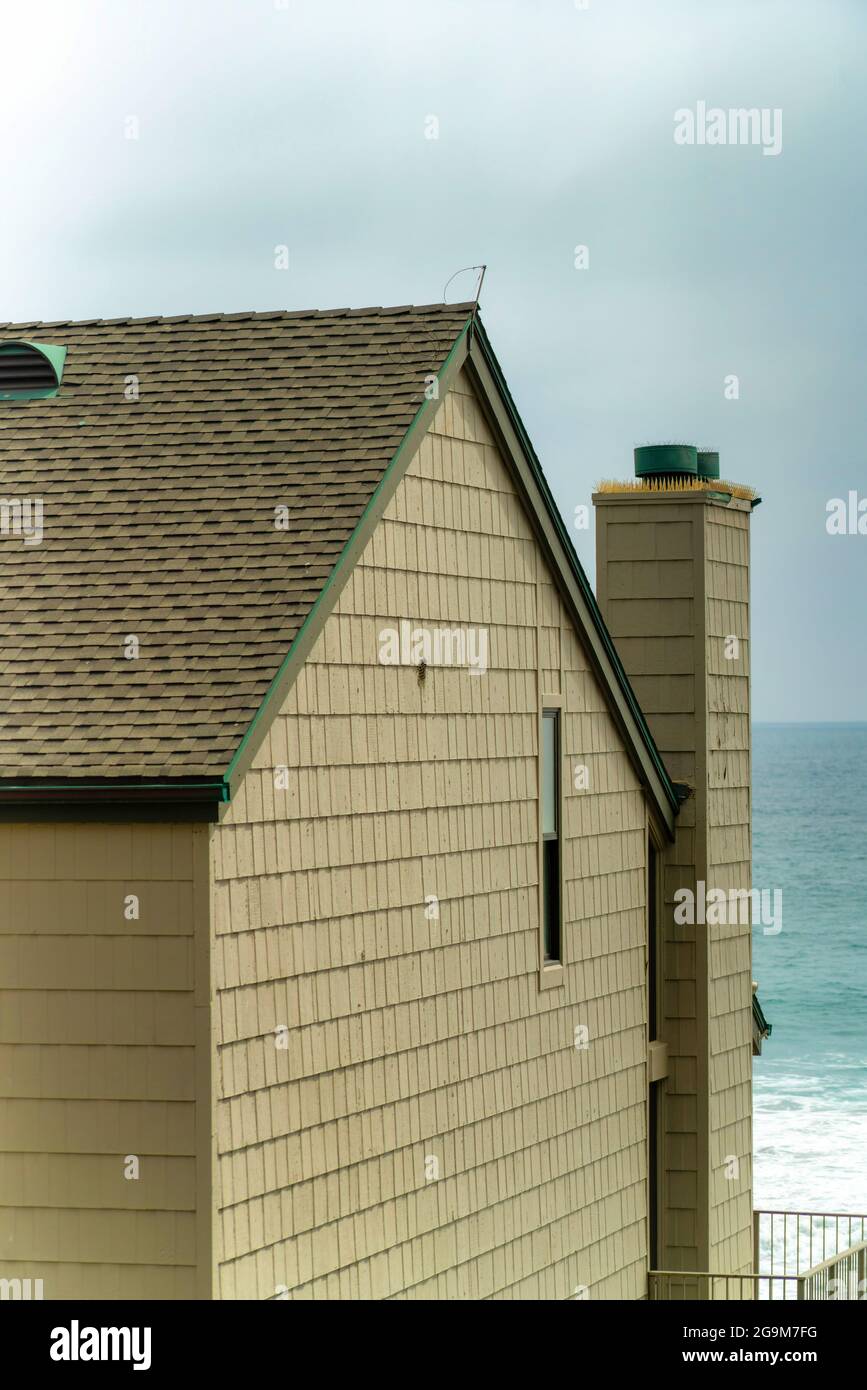 Chimney of a building with shingles roof Stock Photo - Alamy