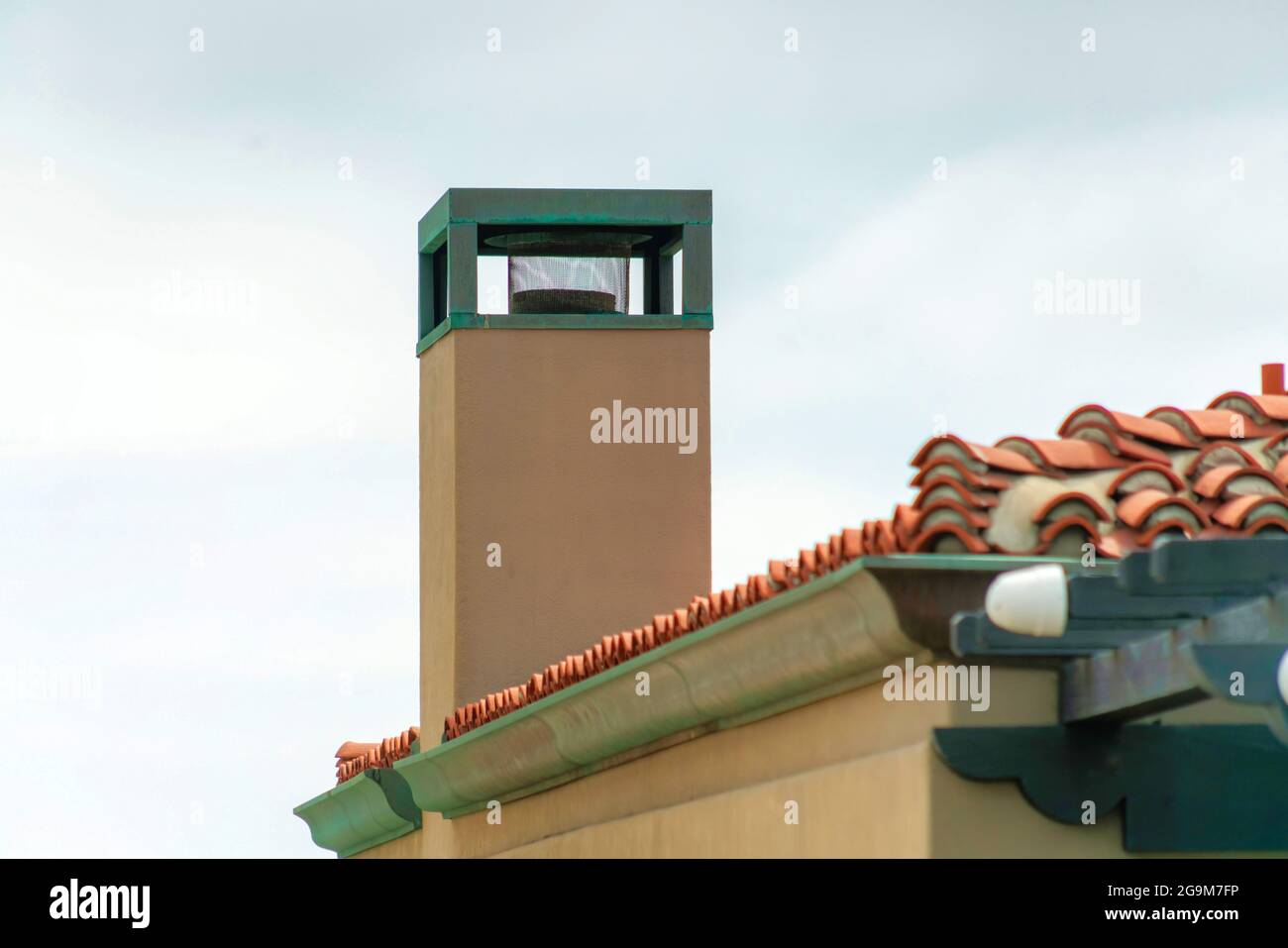 Chimney of a building with shingles roof Stock Photo - Alamy