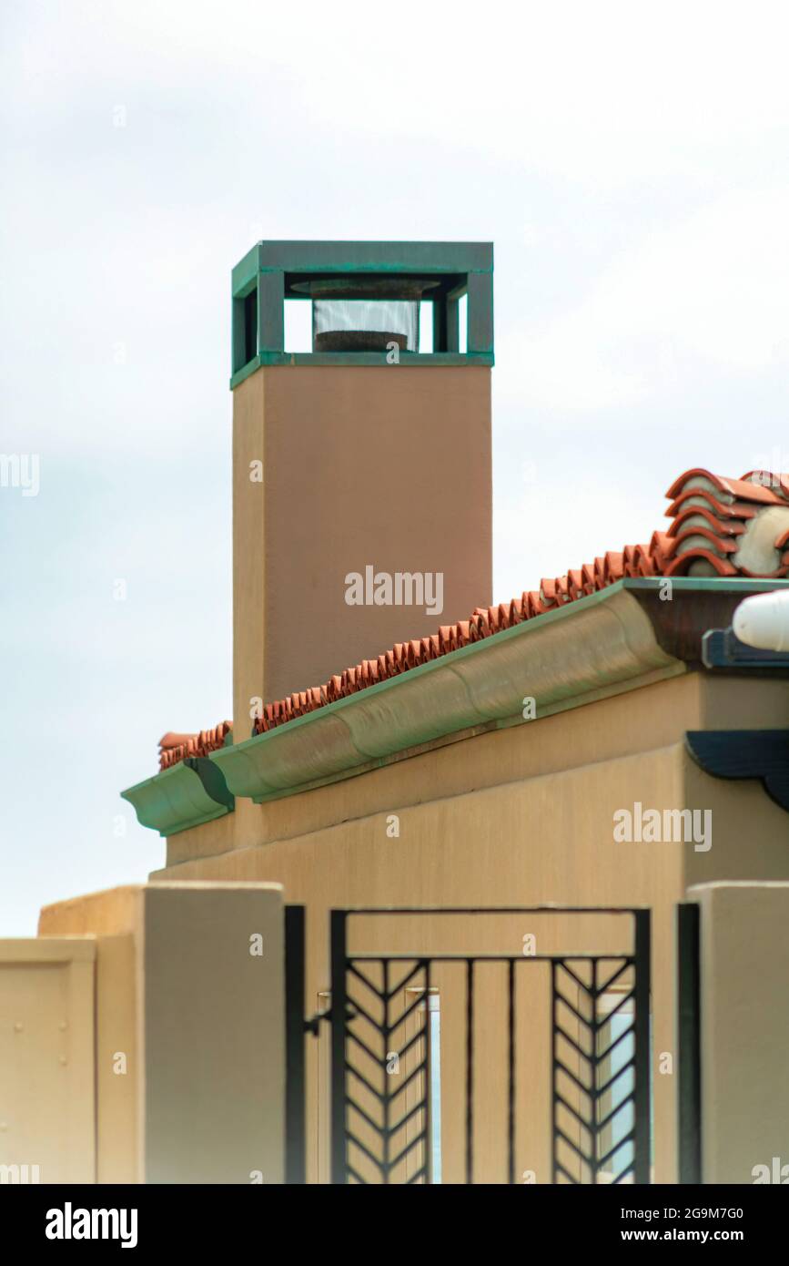 Chimney of a building with shingles roof Stock Photo - Alamy