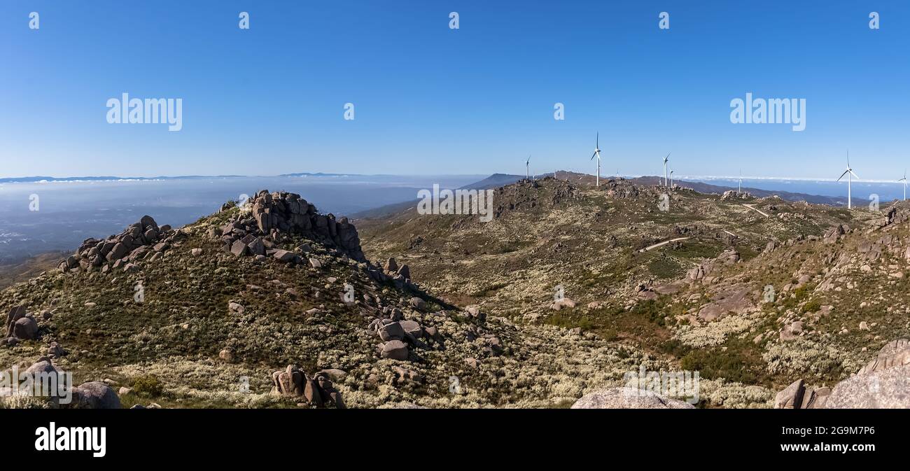 Ultra panoramic view at the Caramulo mountains, with wind turbines and ...
