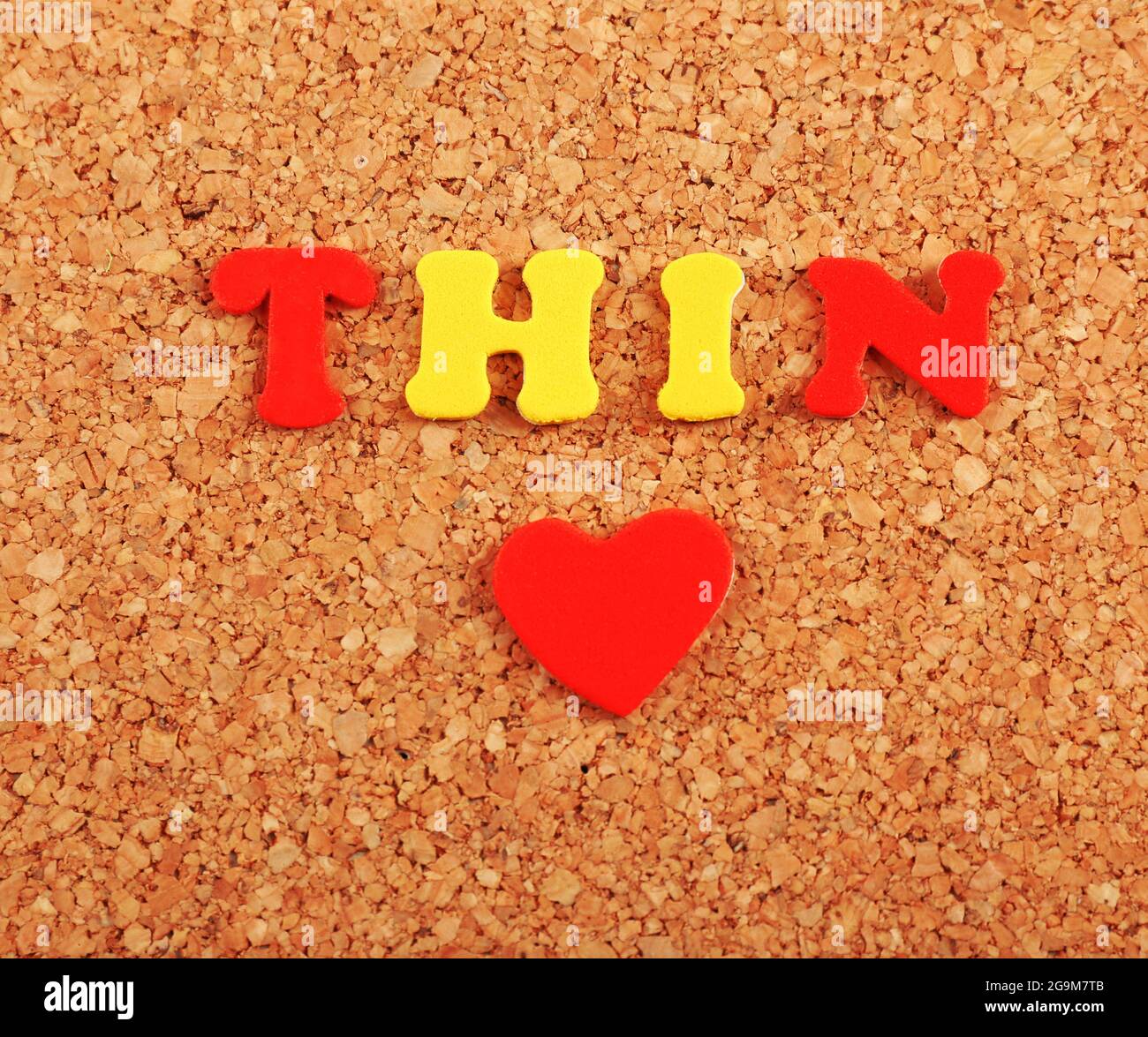 Thin word on cork board background Stock Photo - Alamy