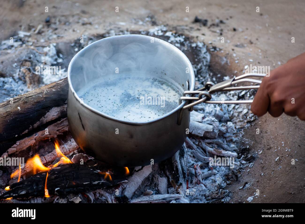 Desi chai tea making in village of india Stock Photo - Alamy