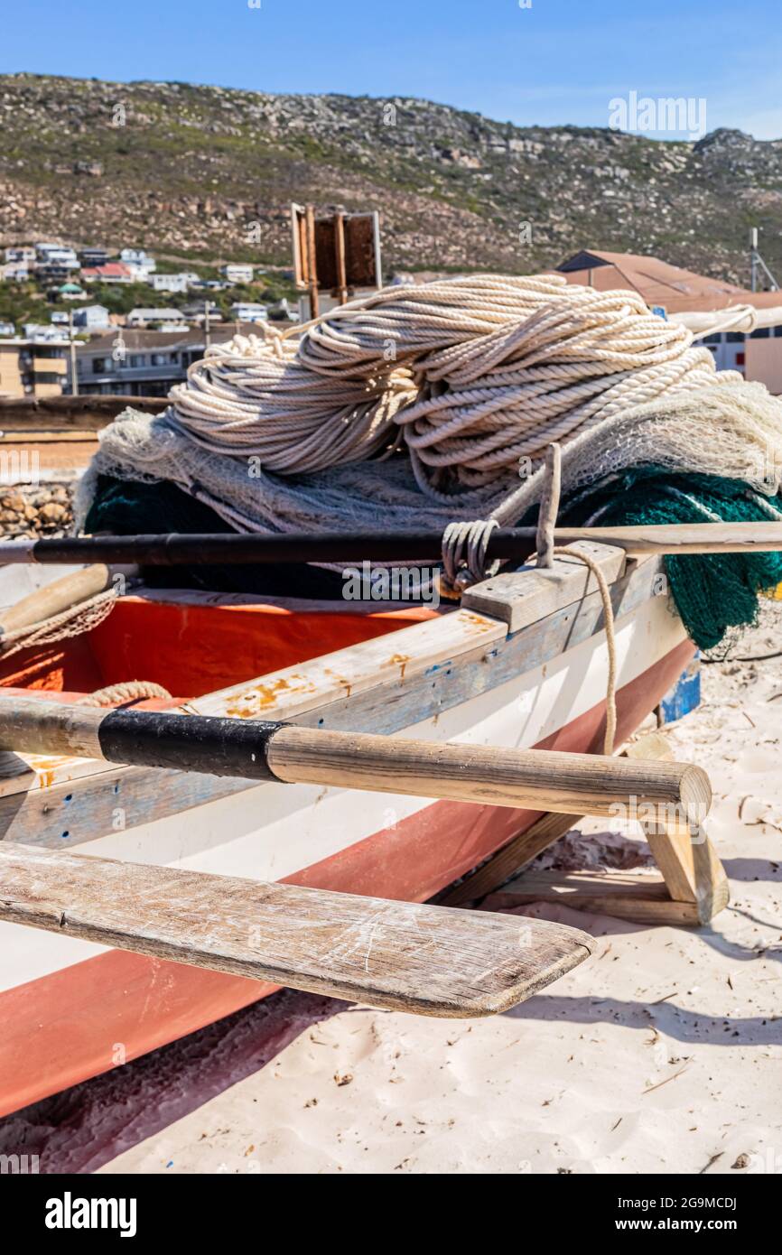 traditional fishing net and rope on small rowing boat on beach Stock ...
