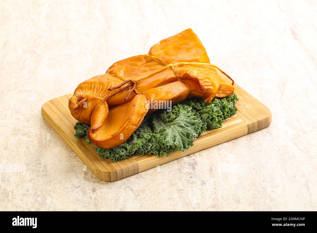 Smoked squid calamar appetizer snack isolated Stock Photo - Alamy