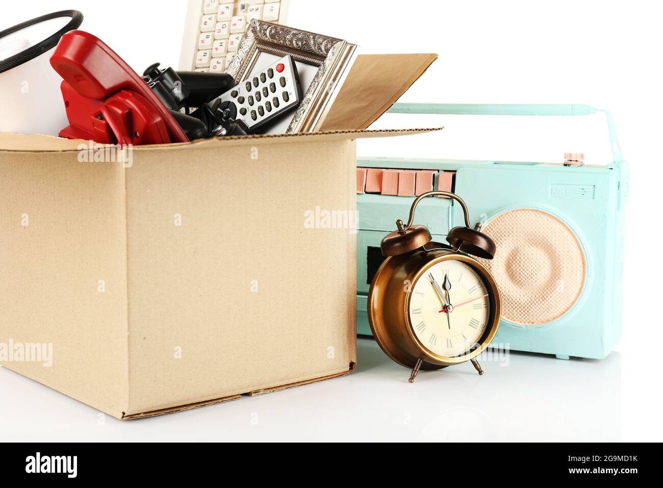 Box of unwanted stuff isolated on white Stock Photo - Alamy