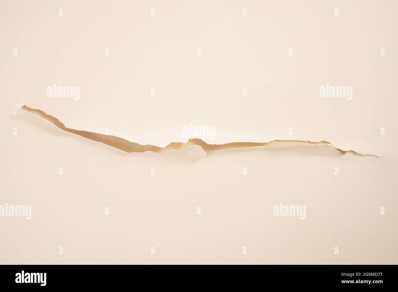 the longitudinal tear of a cardboard Stock Photo - Alamy
