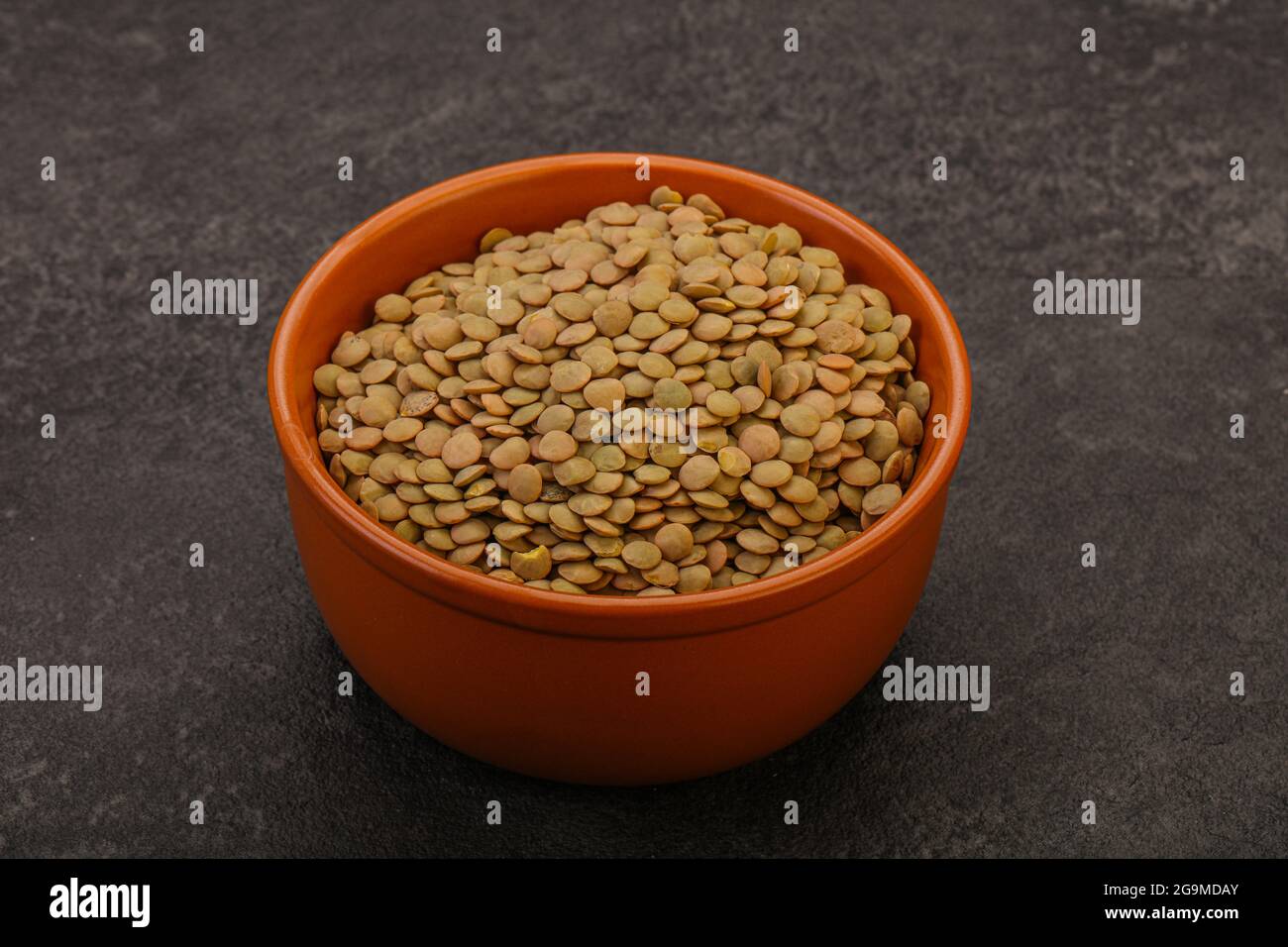 Vegan cuisine - Dry lentil heap isolated Stock Photo - Alamy