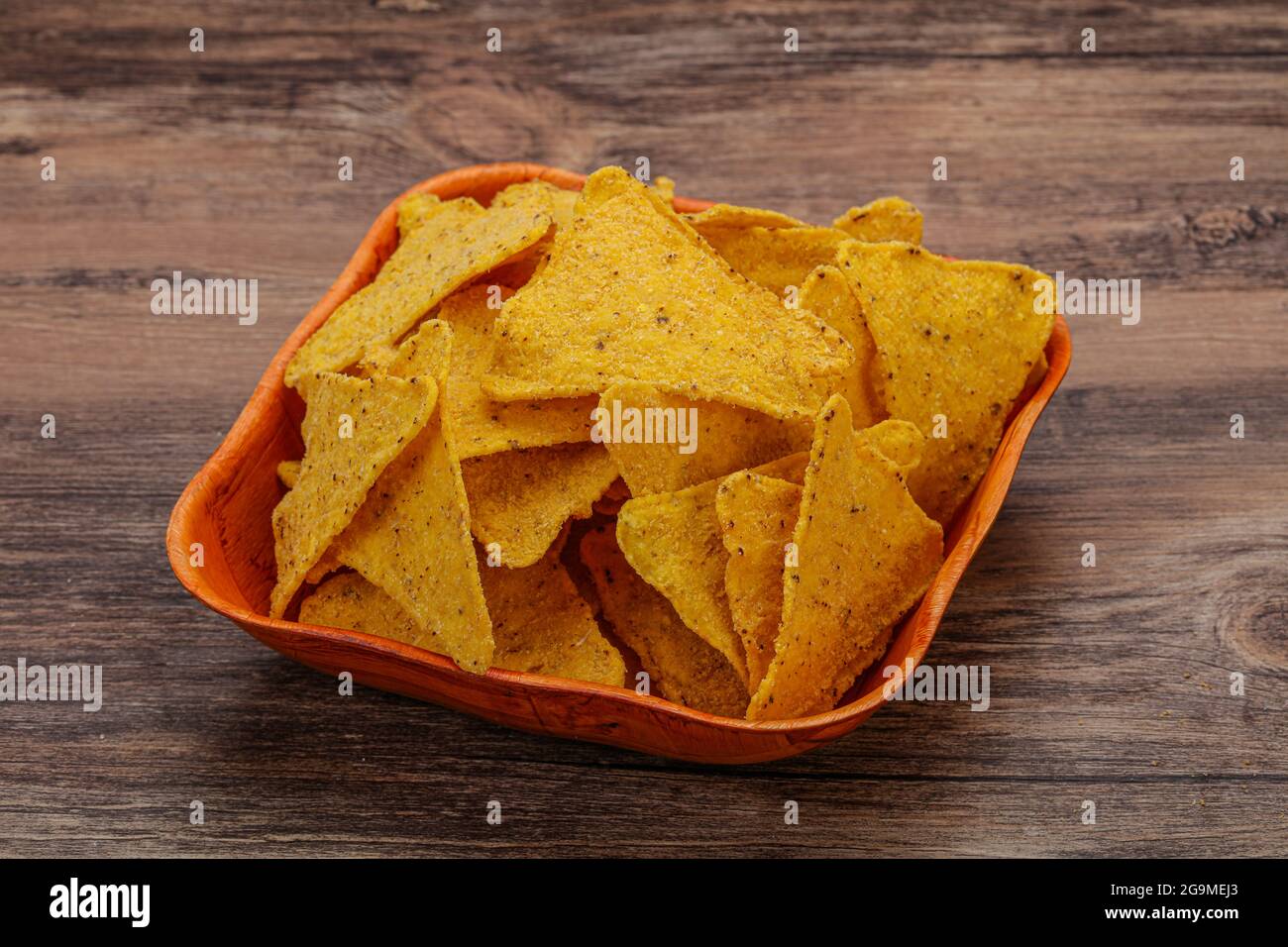 Mexican crunchy corn nachos triangle heap Stock Photo - Alamy