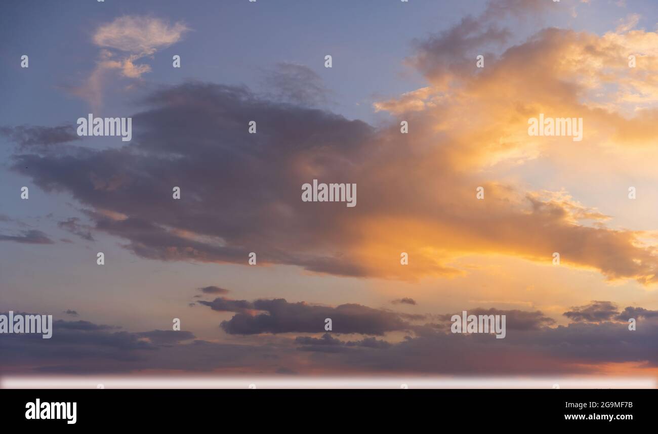 Sky background: sunset reflecting on clouds Stock Photo - Alamy
