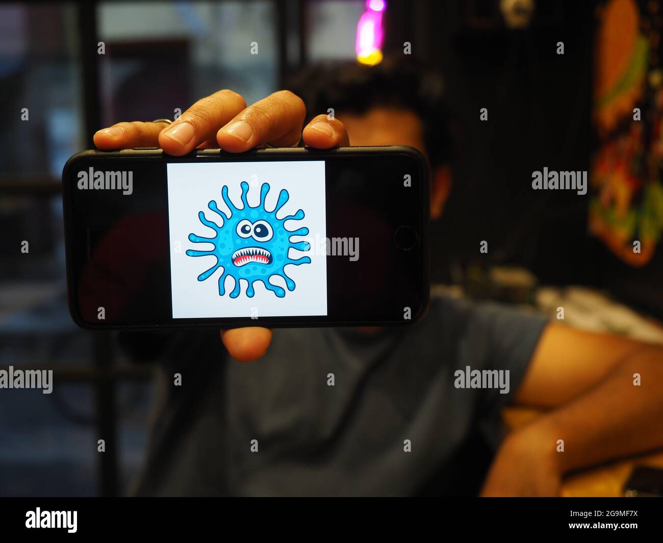 KOLKATA, INDIA - Jul 23, 2021: hand holding an infected generated ...