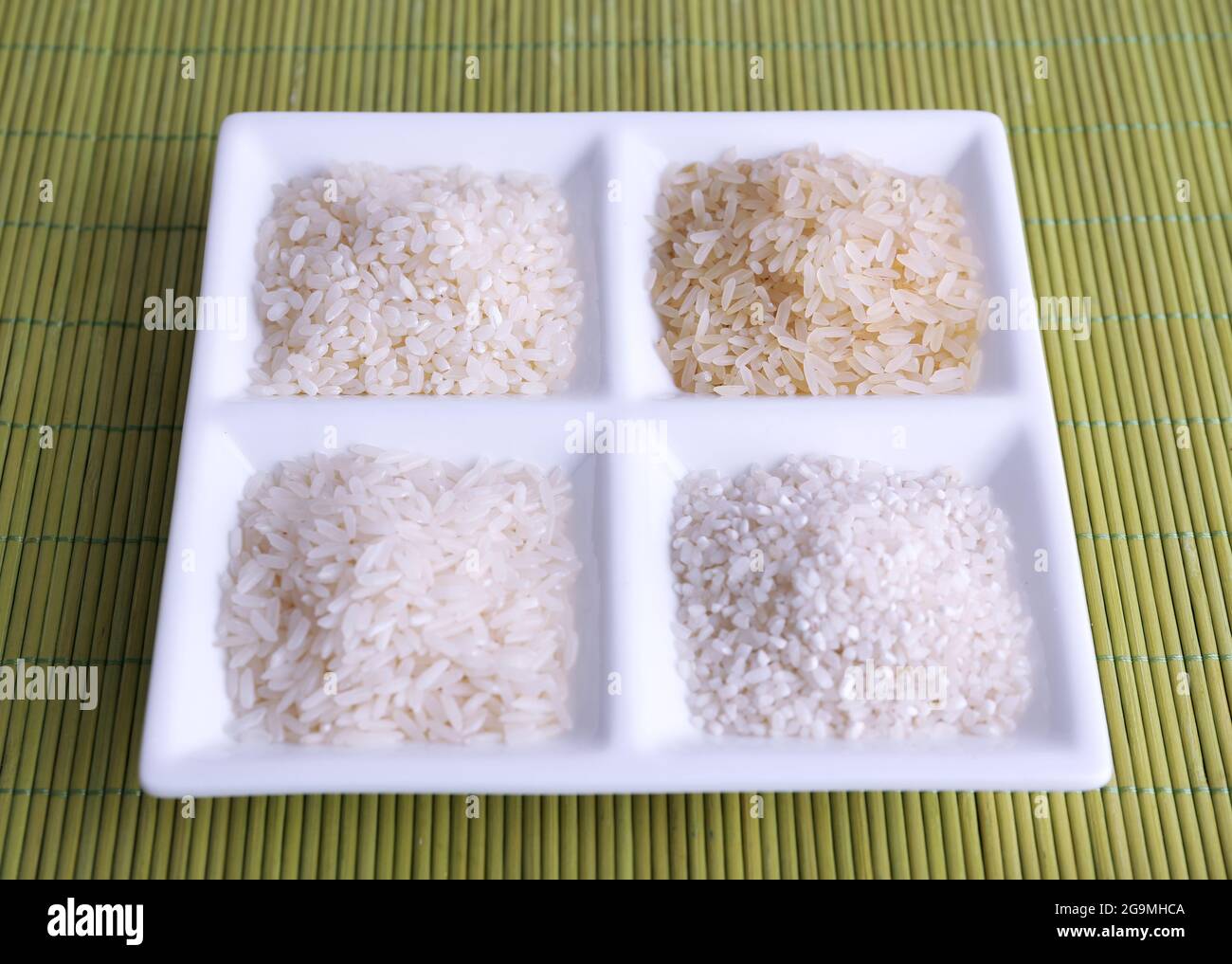 Different types of rice on plate on bamboo background Stock Photo - Alamy