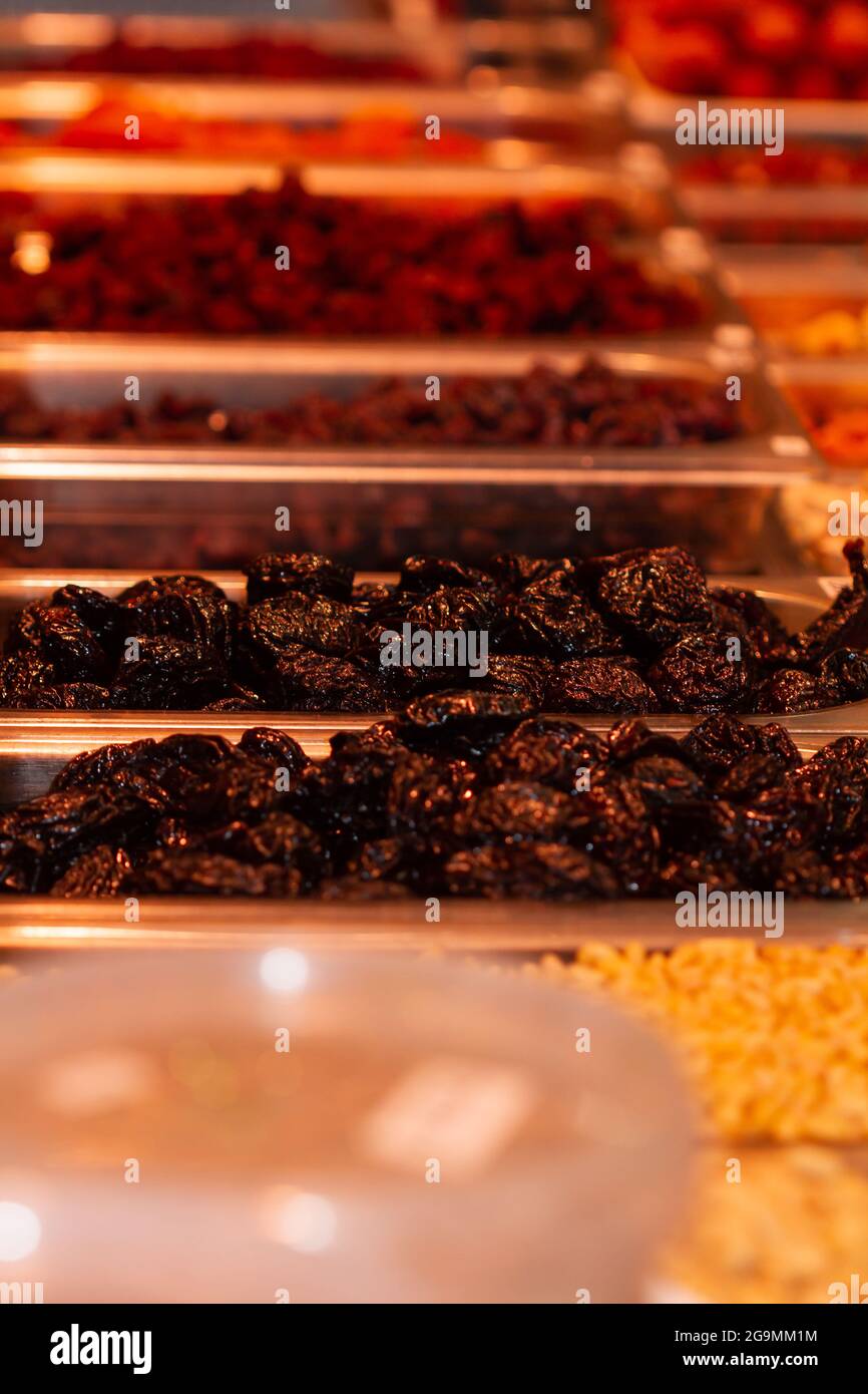 Selective focus of different types of raisins in aluminum containers at ...