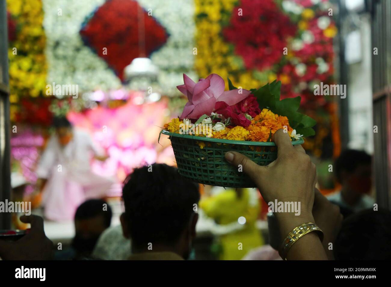 Devotees stand in queue with Jal and fruit thali an offering for ...