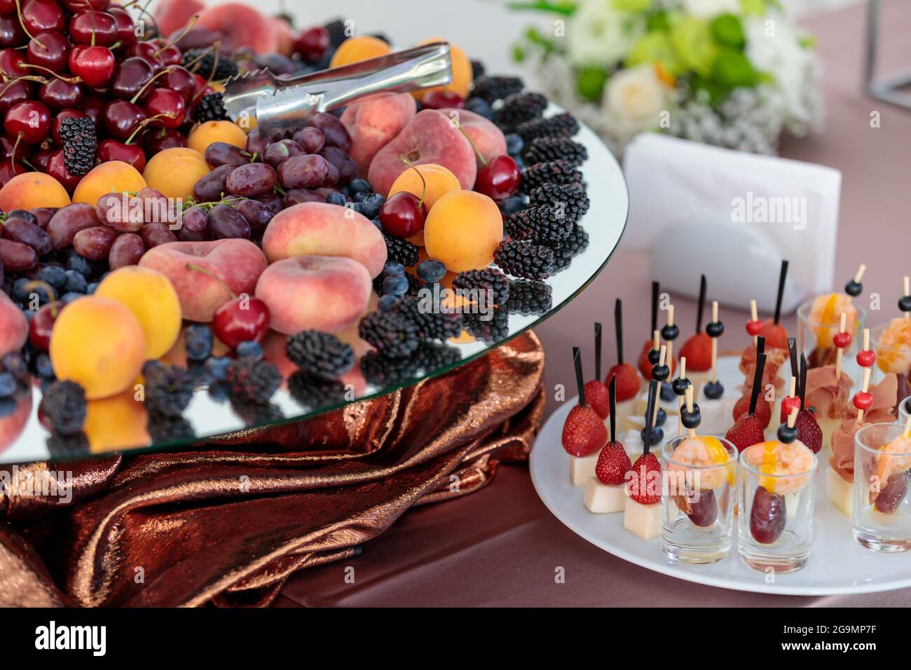 table with a variety of fruit snacks and berries. Buffet for a company ...