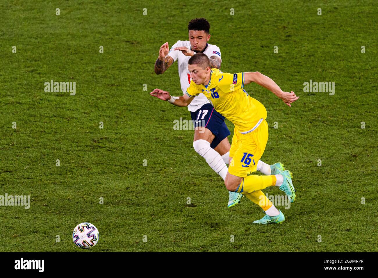 Rome, Italy - 03 July: Vitalii Mykolenko of Ukraine (L) is chased by ...