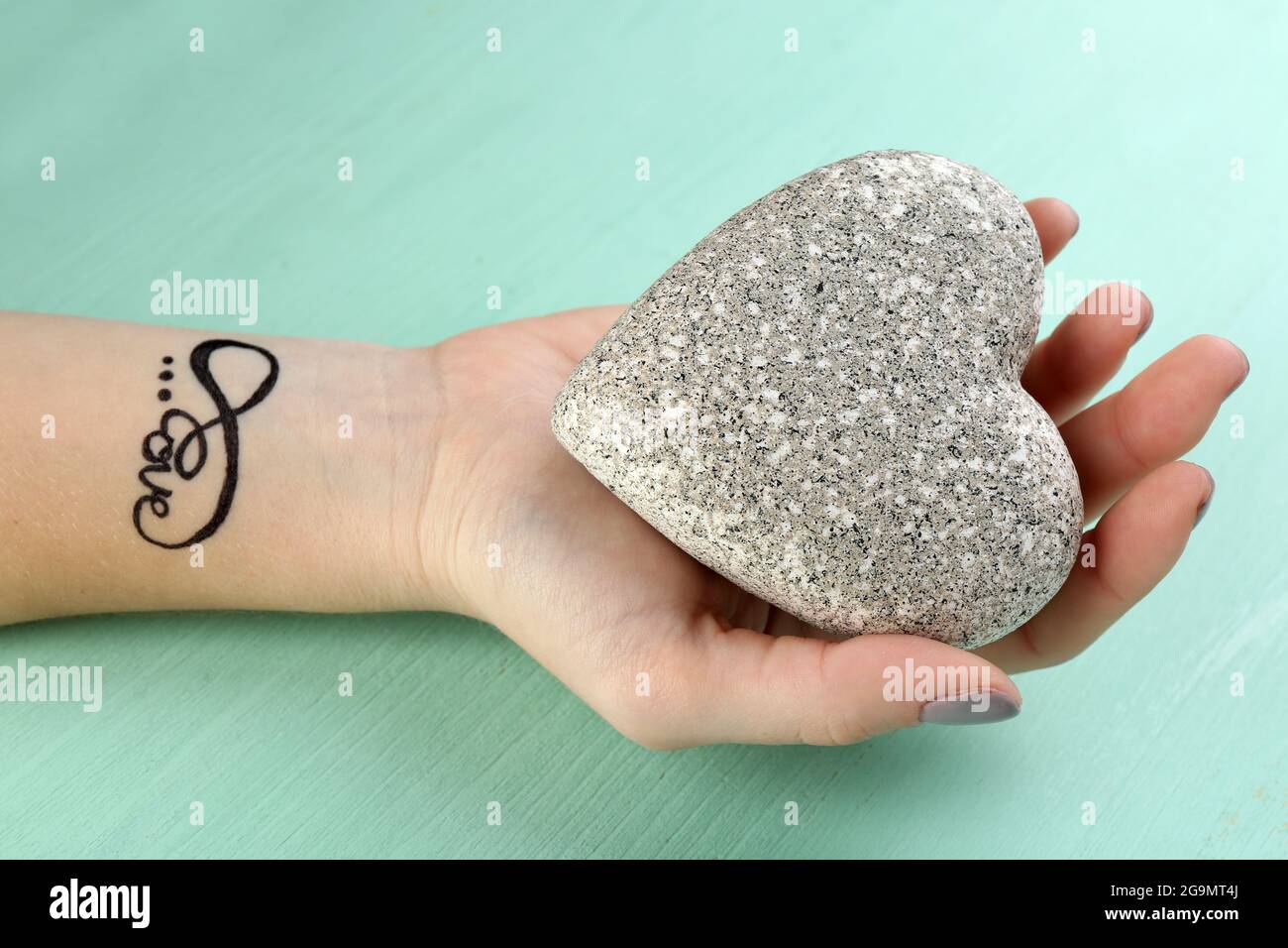 Heart In Hand Tattoo