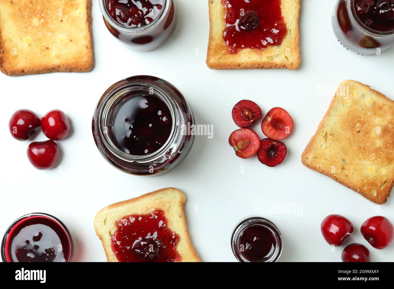 Cherry jam sandwiches and ingredients on white background Stock Photo ...