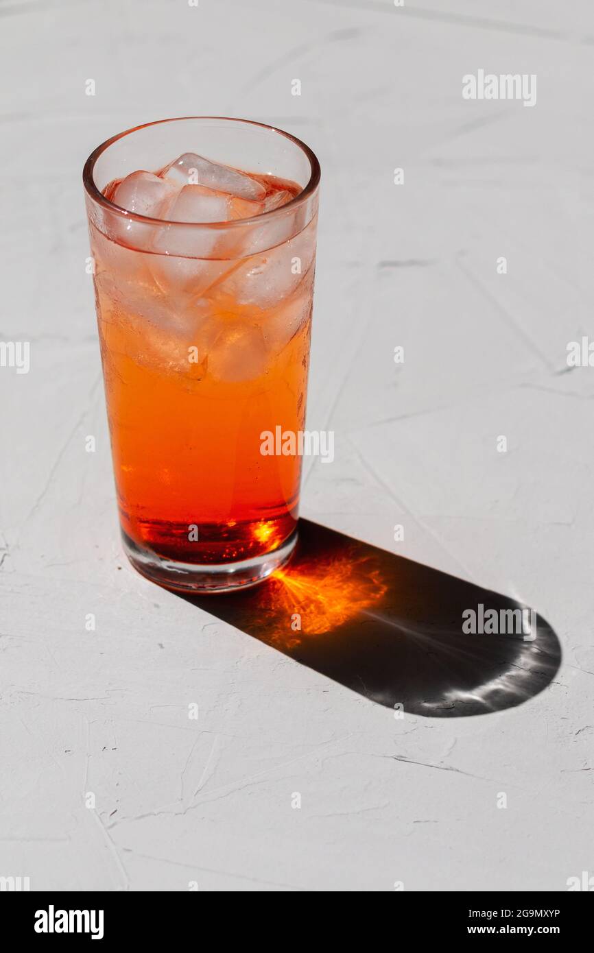 Wet glass with cold cocktail and ice inside, summertime drink Stock ...