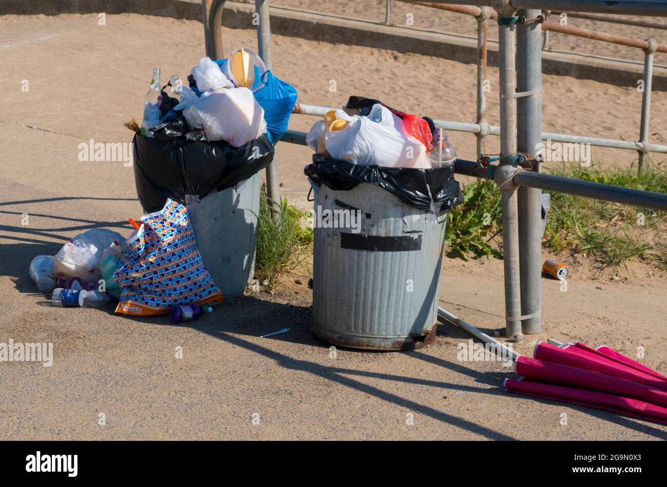 Full rubbish bins Stock Photo - Alamy