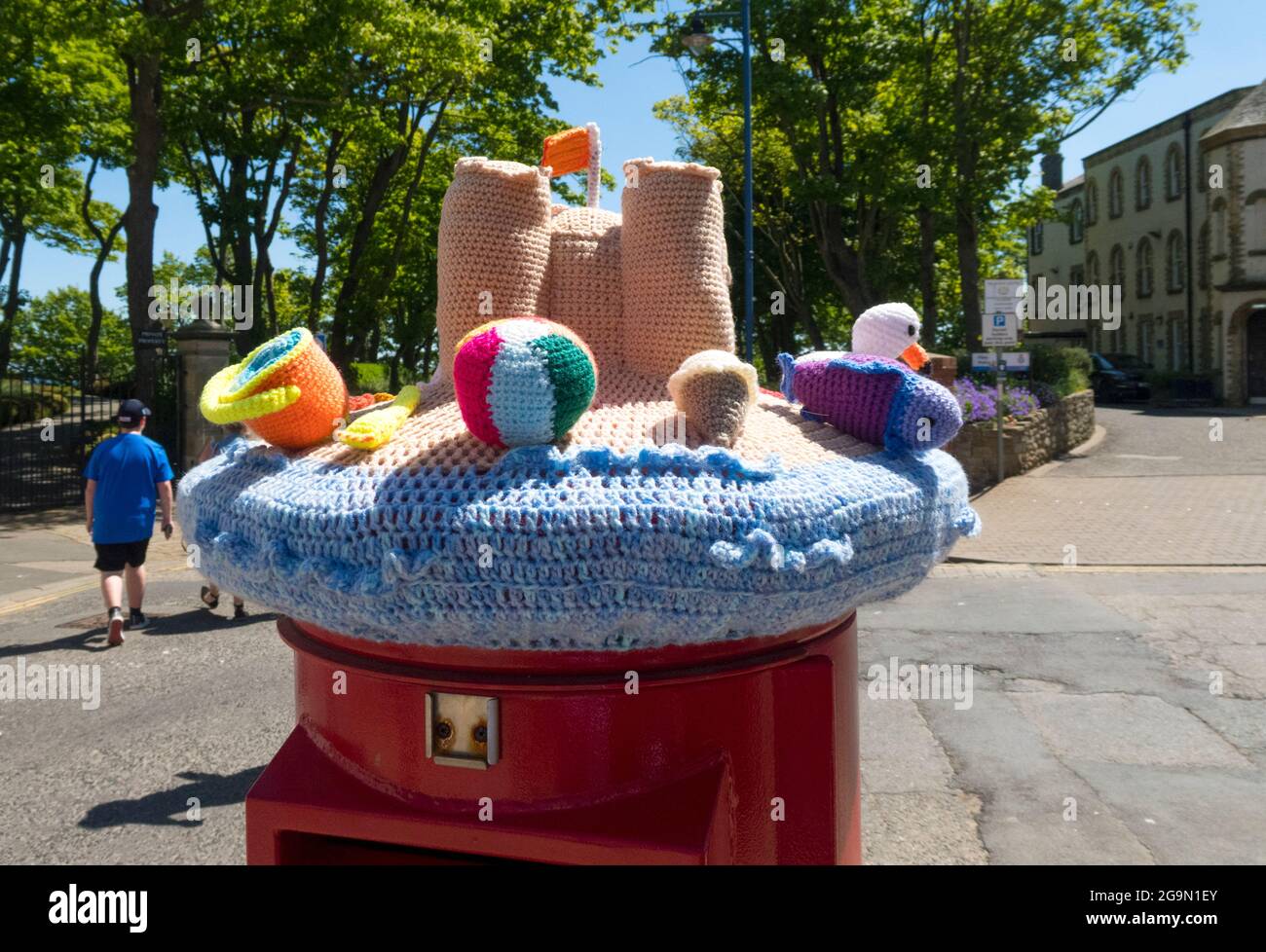 Knitted ornament on post box Stock Photo - Alamy