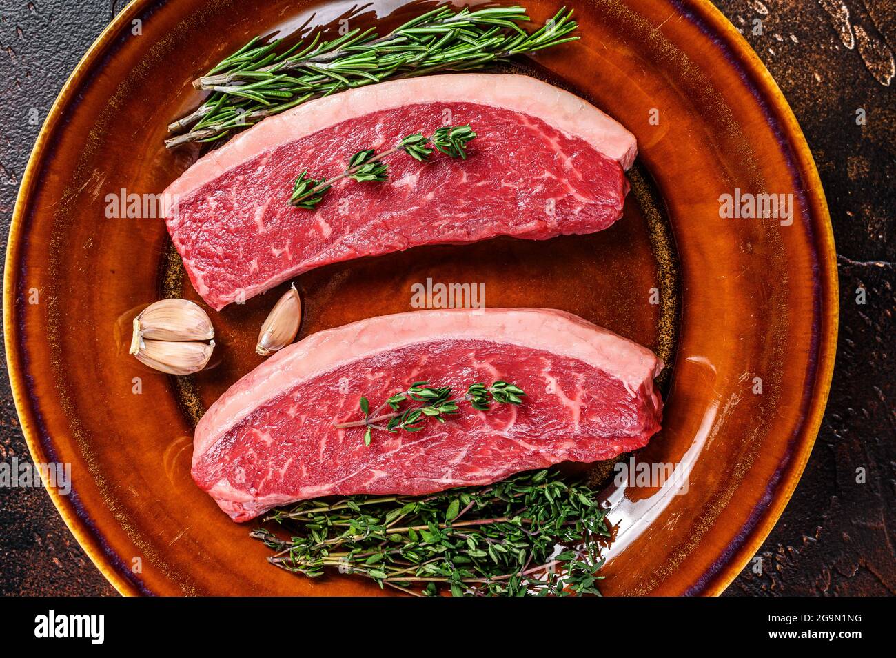 Raw cap rump or brazilian picanha beef meat steak. Dark background. Top ...