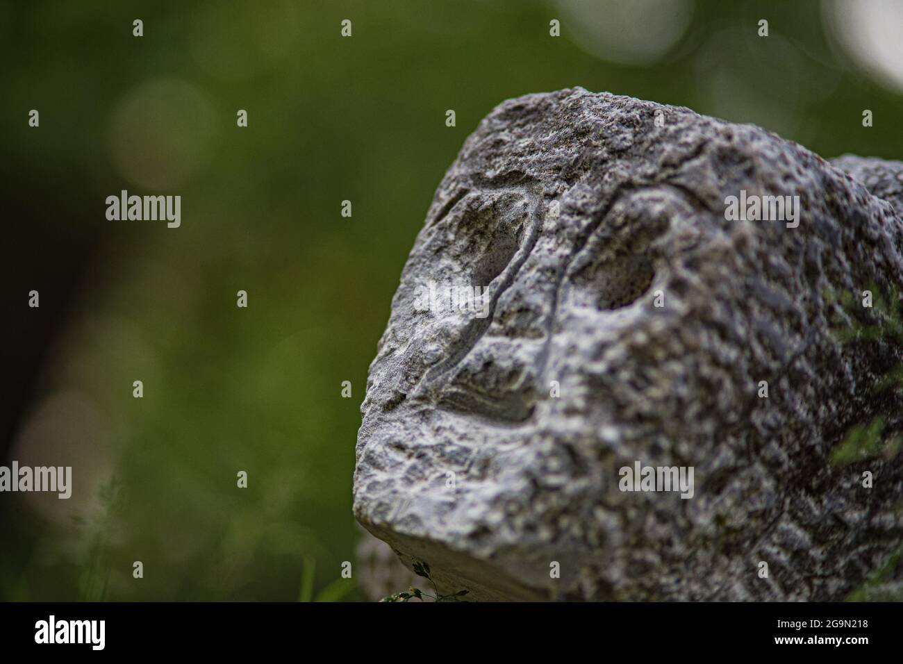 Selective focus shot of a stone sculpture with a female face Stock ...