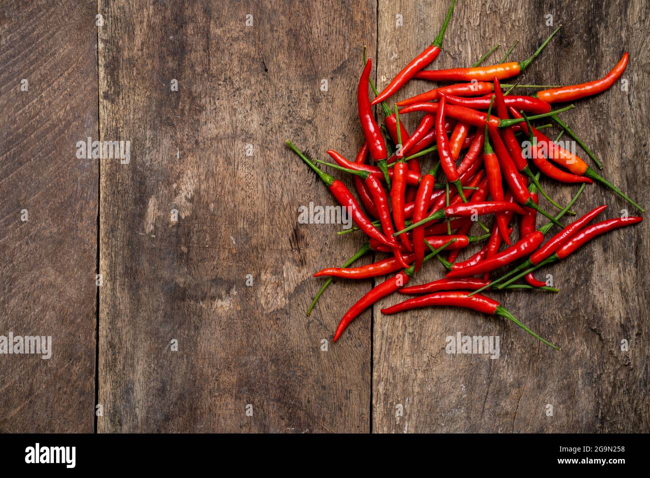 Top view of red pepper on a rusty wooden surface, with copy space Stock ...