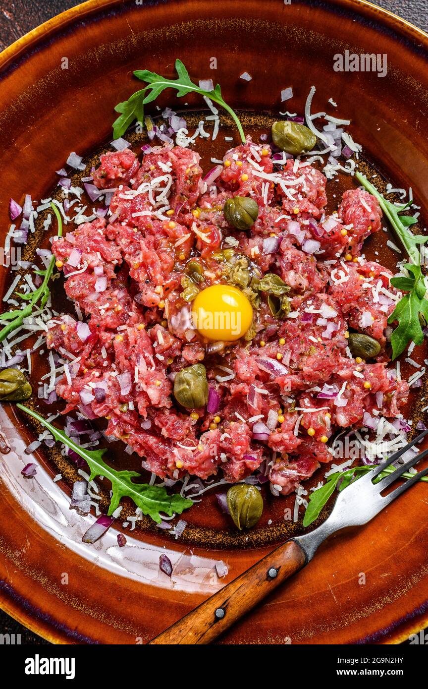 Beef steak tartare with raw egg yolk, pickled capers and Parmesan ...