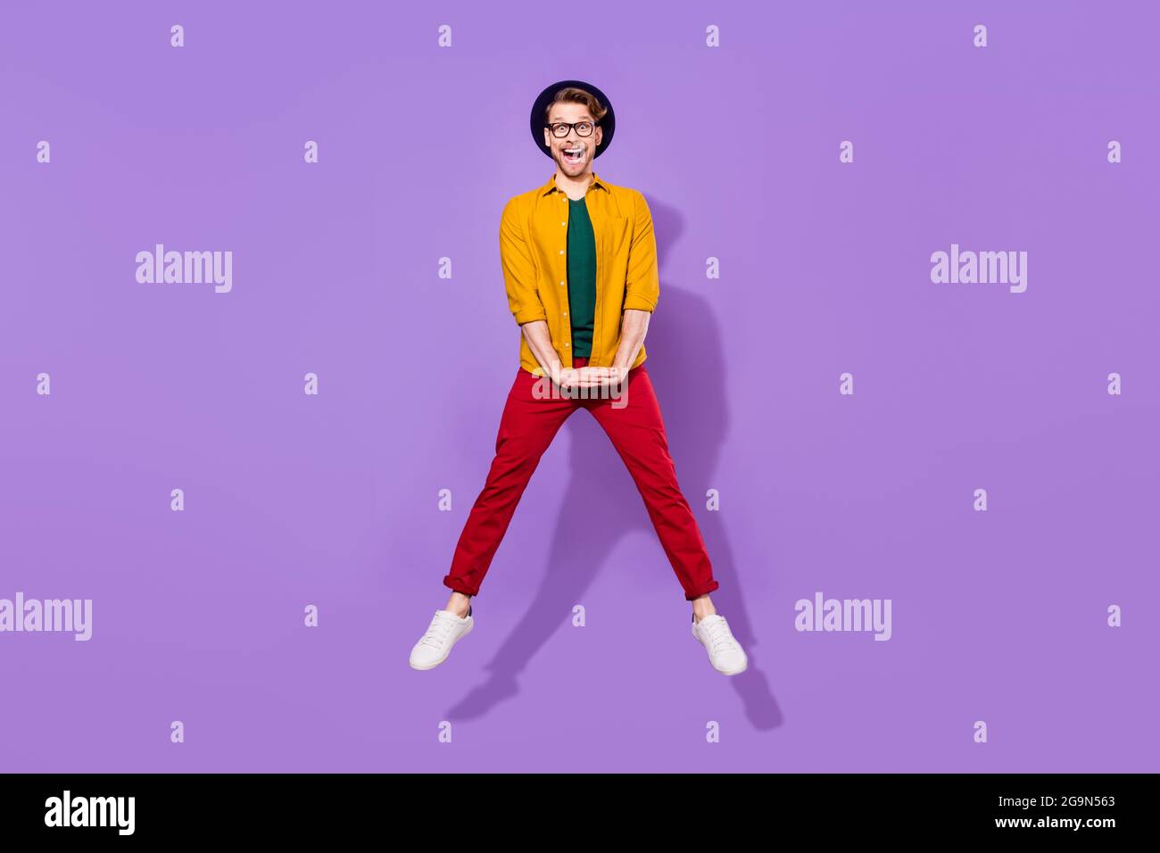 Full body photo of young guy happy positive smile have fun jump up ...