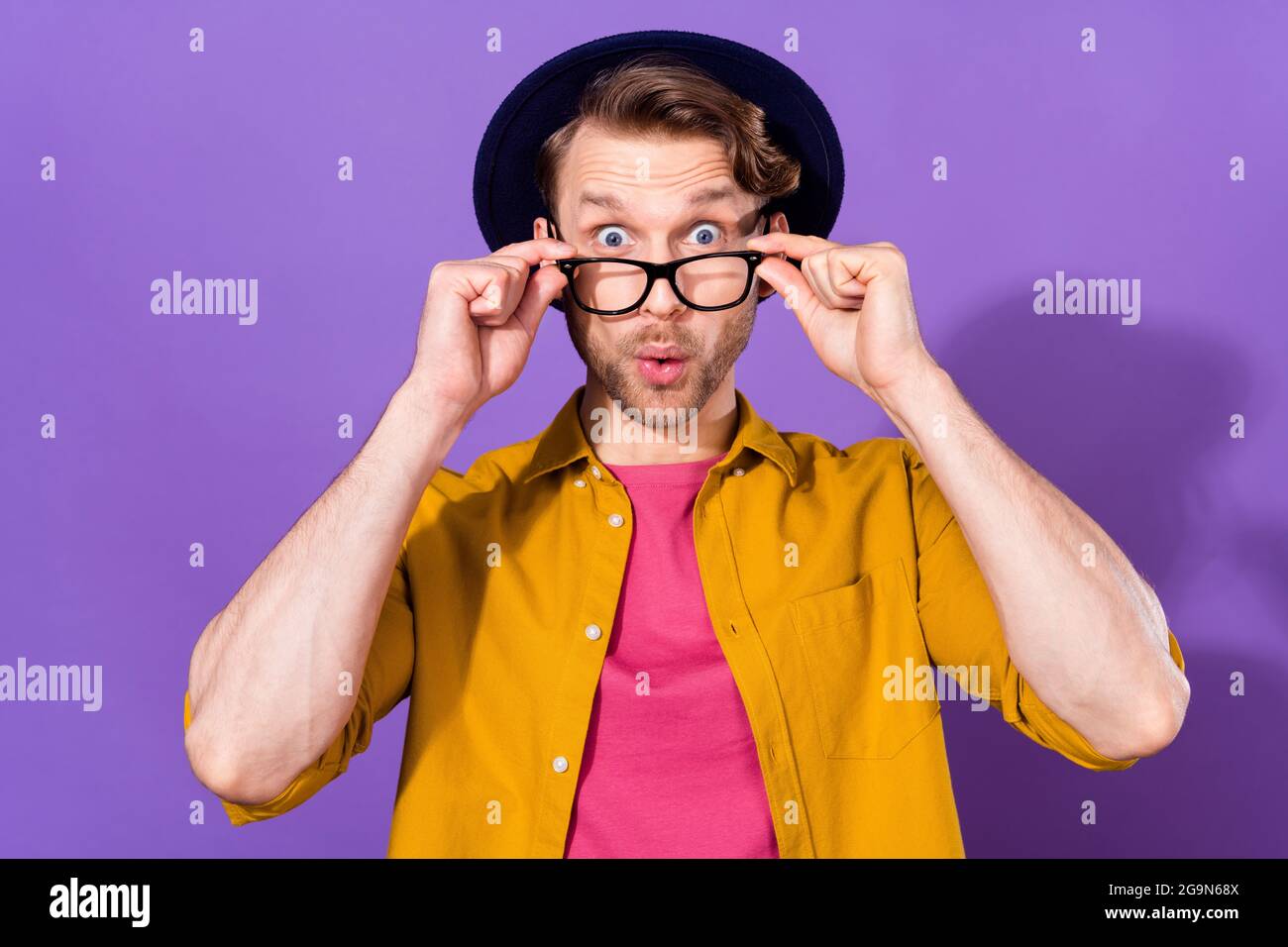 Photo of young man amazed shocked surprised hands touch glasses fake ...