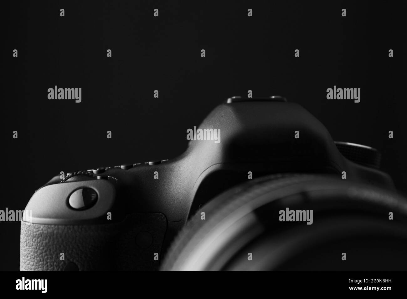 Digital camera on dark background Stock Photo - Alamy