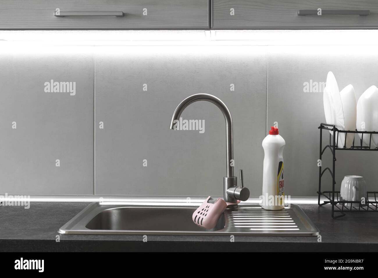 Modern kitchen sink and faucet with backlight on, kitchen design Stock ...