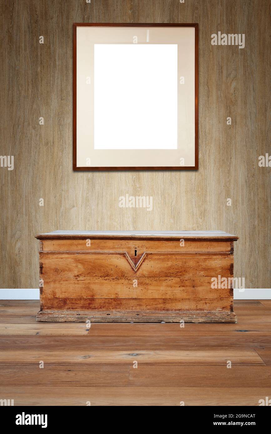 Old-fashioned wooden chest against textured wood wall and frame Stock ...