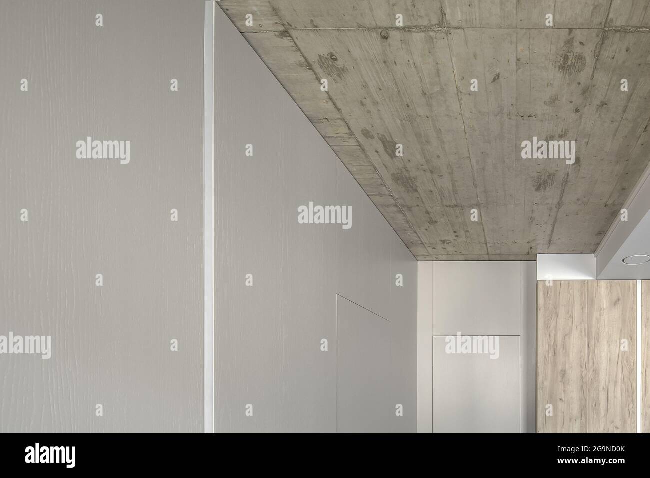 Room corner, three different textures: grey wall, natural oak wood ...