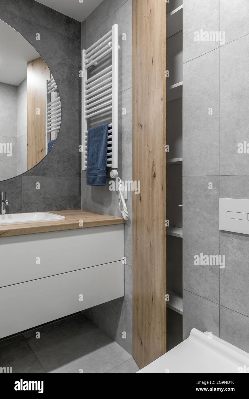 Modern minimalist bathroom interior design with grey stone tiles and ...