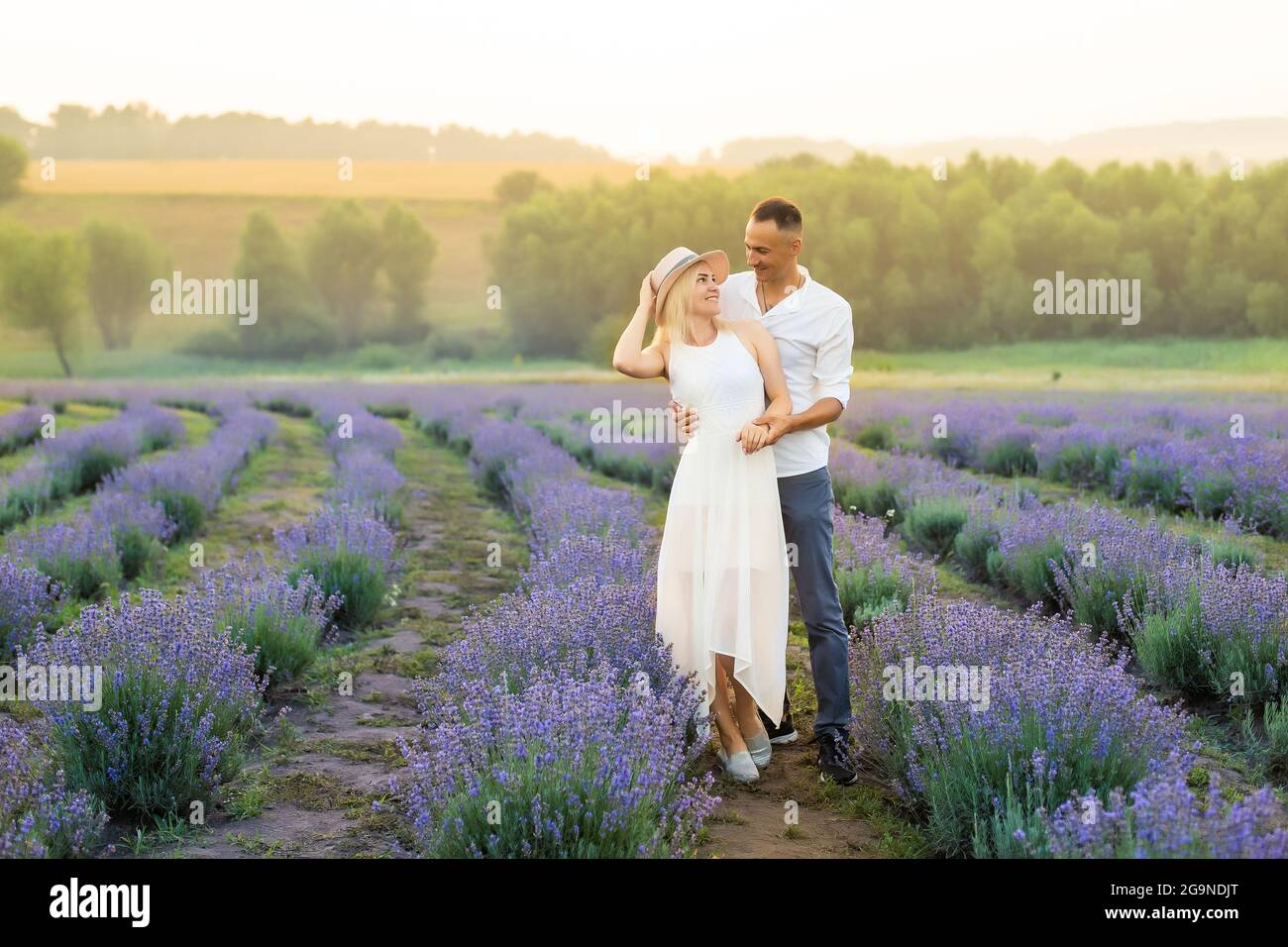 Couple in lavender field. Couple in hug Stock Photo - Alamy
