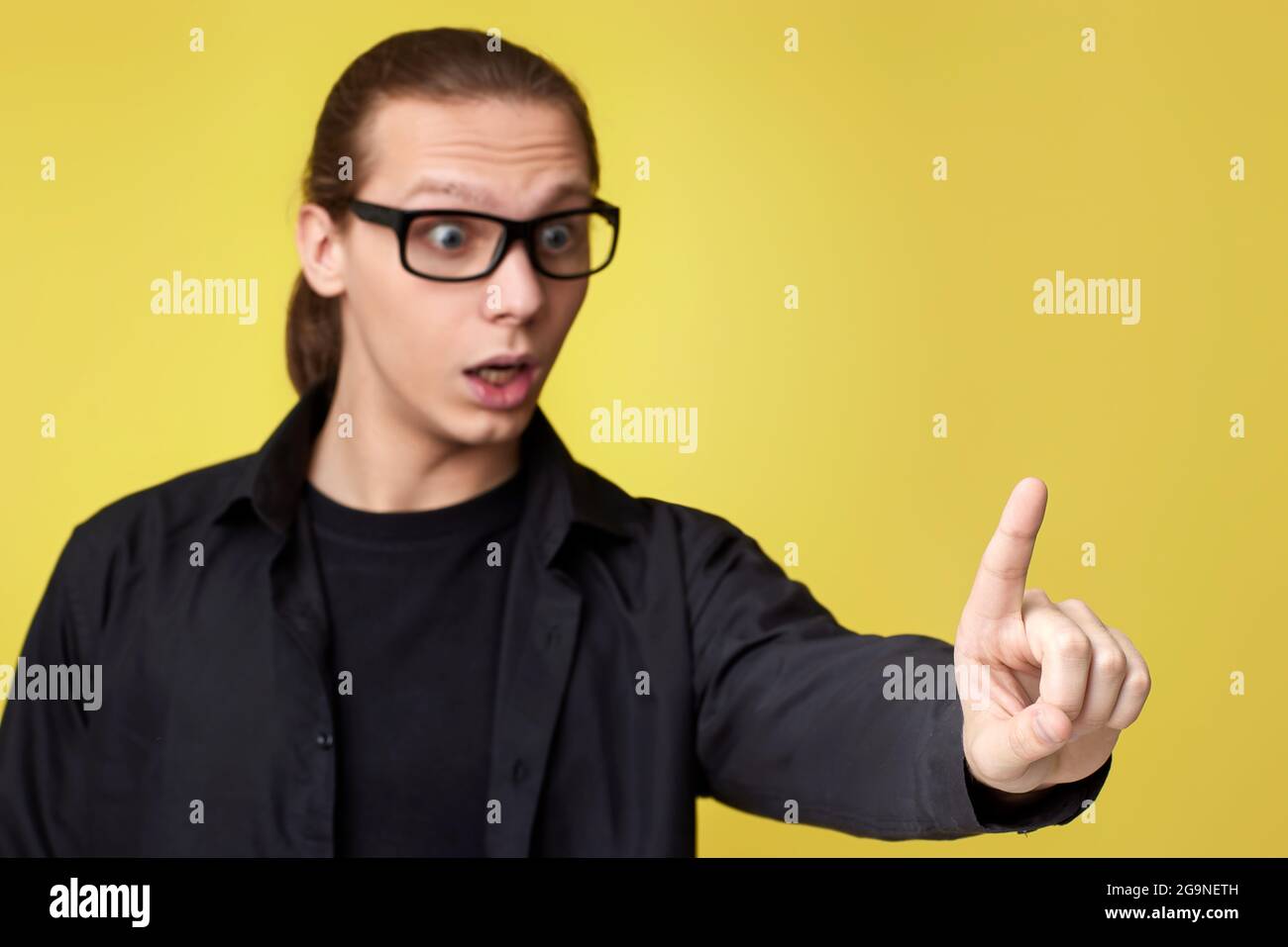 young man in glasses touching virtual screen Stock Photo - Alamy