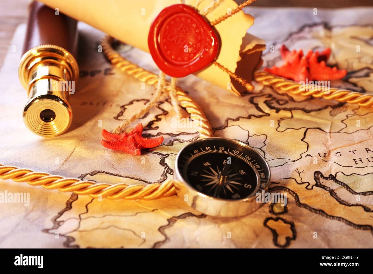 Marine still life with world map and spyglass on wooden table ...