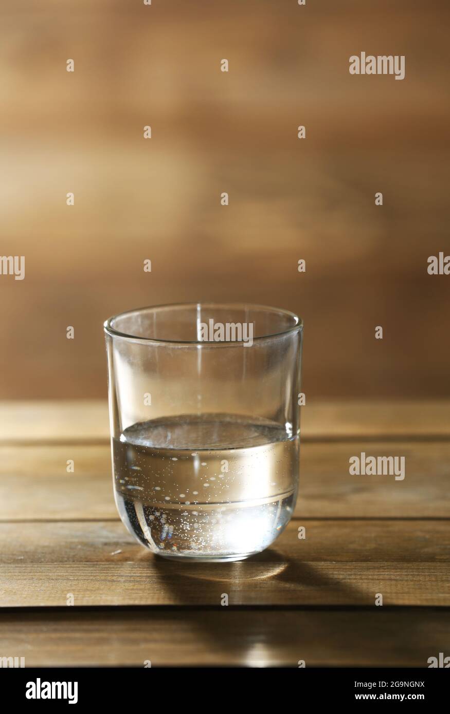 Glass of clean mineral water on rustic wooden background Stock Photo ...
