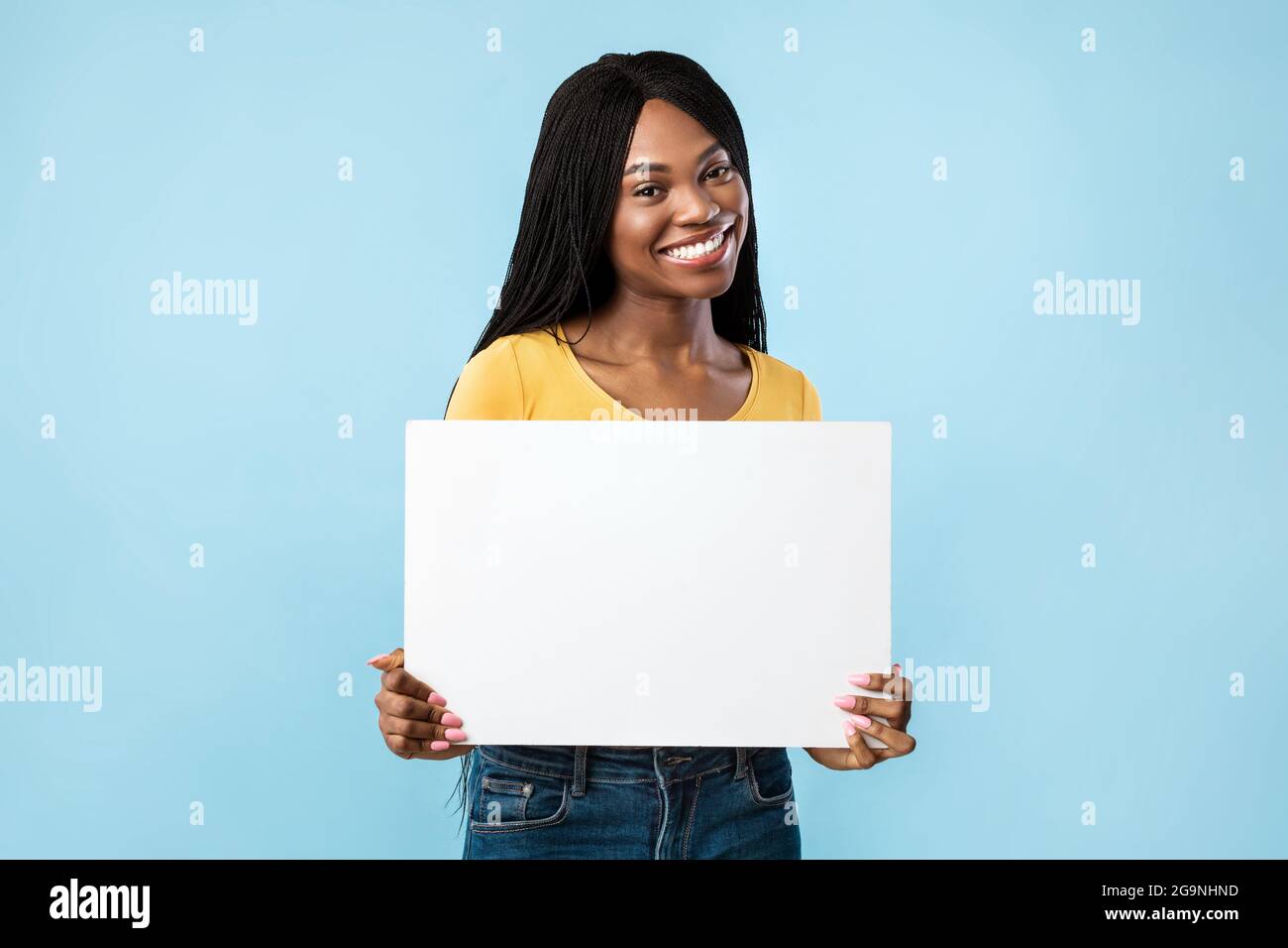 Positive African American Female Showing Empty Paper Board, Blue ...