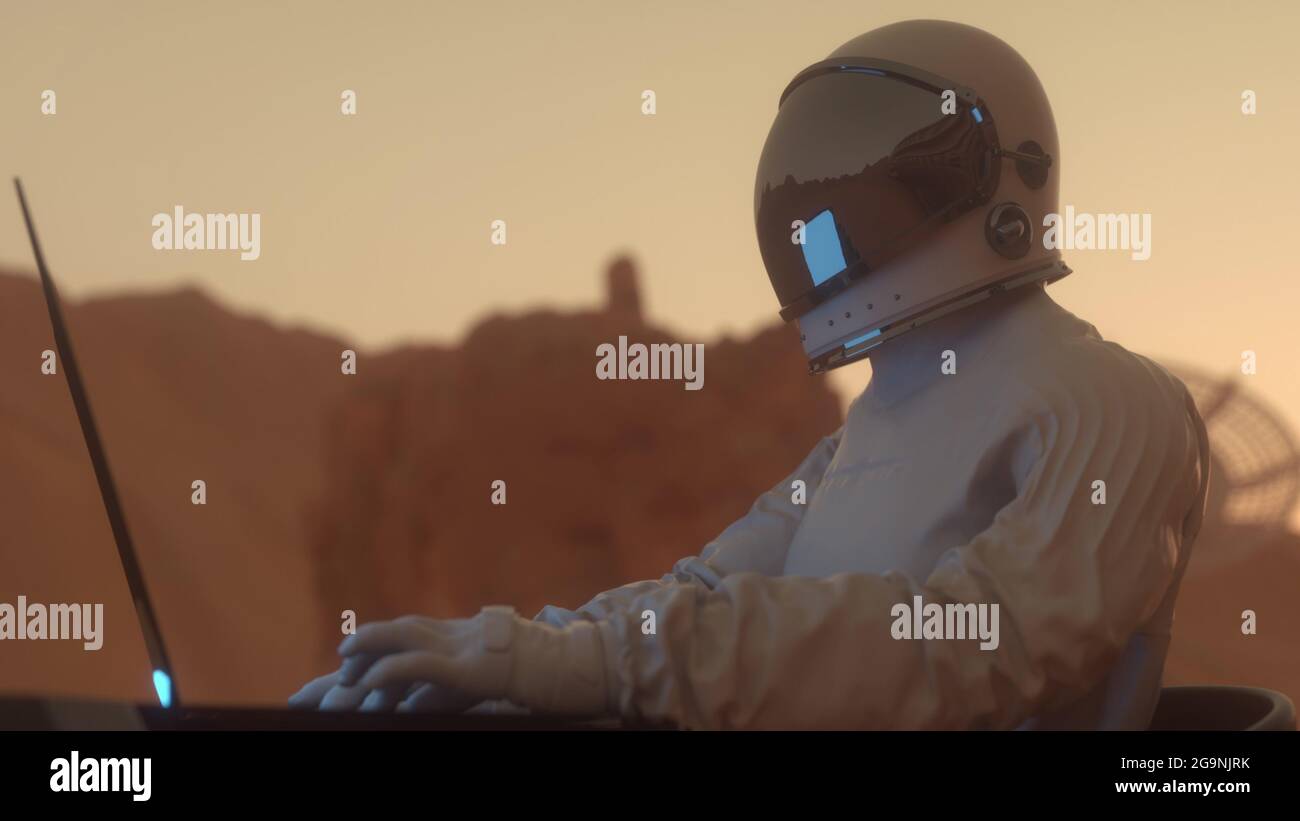 Astronaut works on his science laptop in a space colony on one of the ...