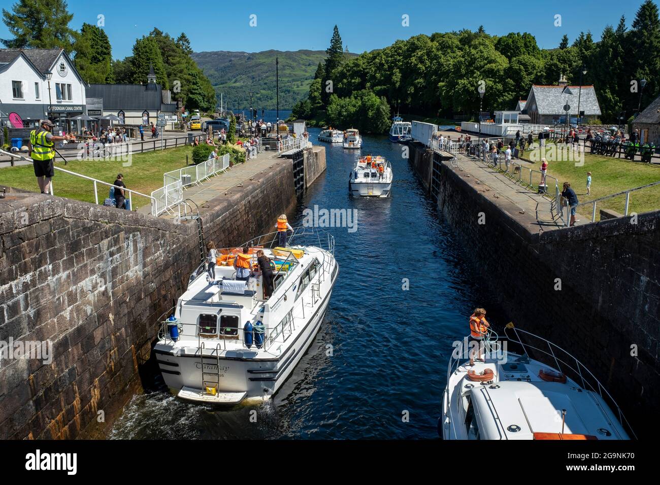 Leisure boats entering Loch Ness through the Caledonian Canal lock ...