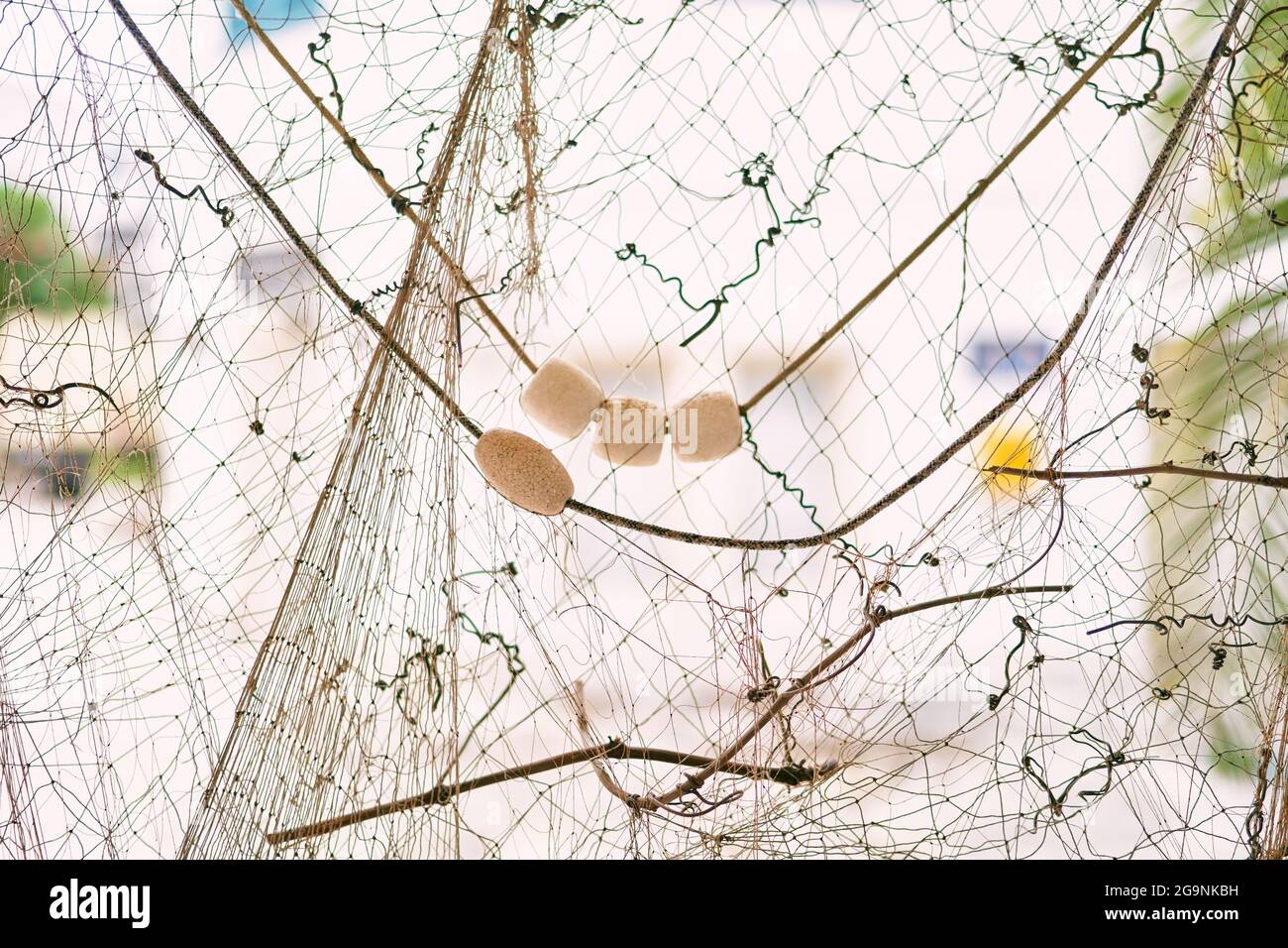 Fishing net with weights on the ropes. Close-up Stock Photo - Alamy