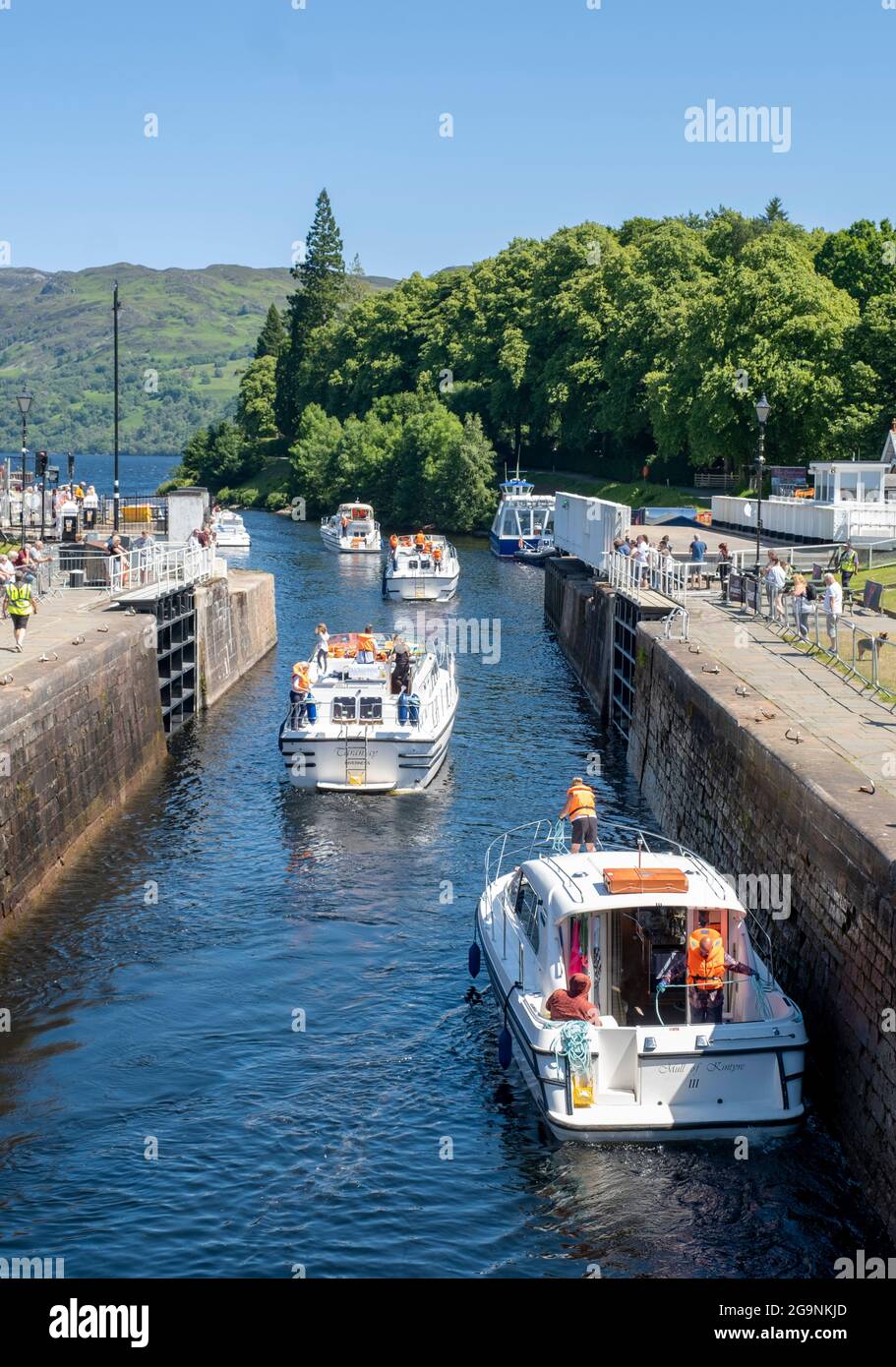 Leisure boats entering Loch Ness through the Caledonian Canal lock ...