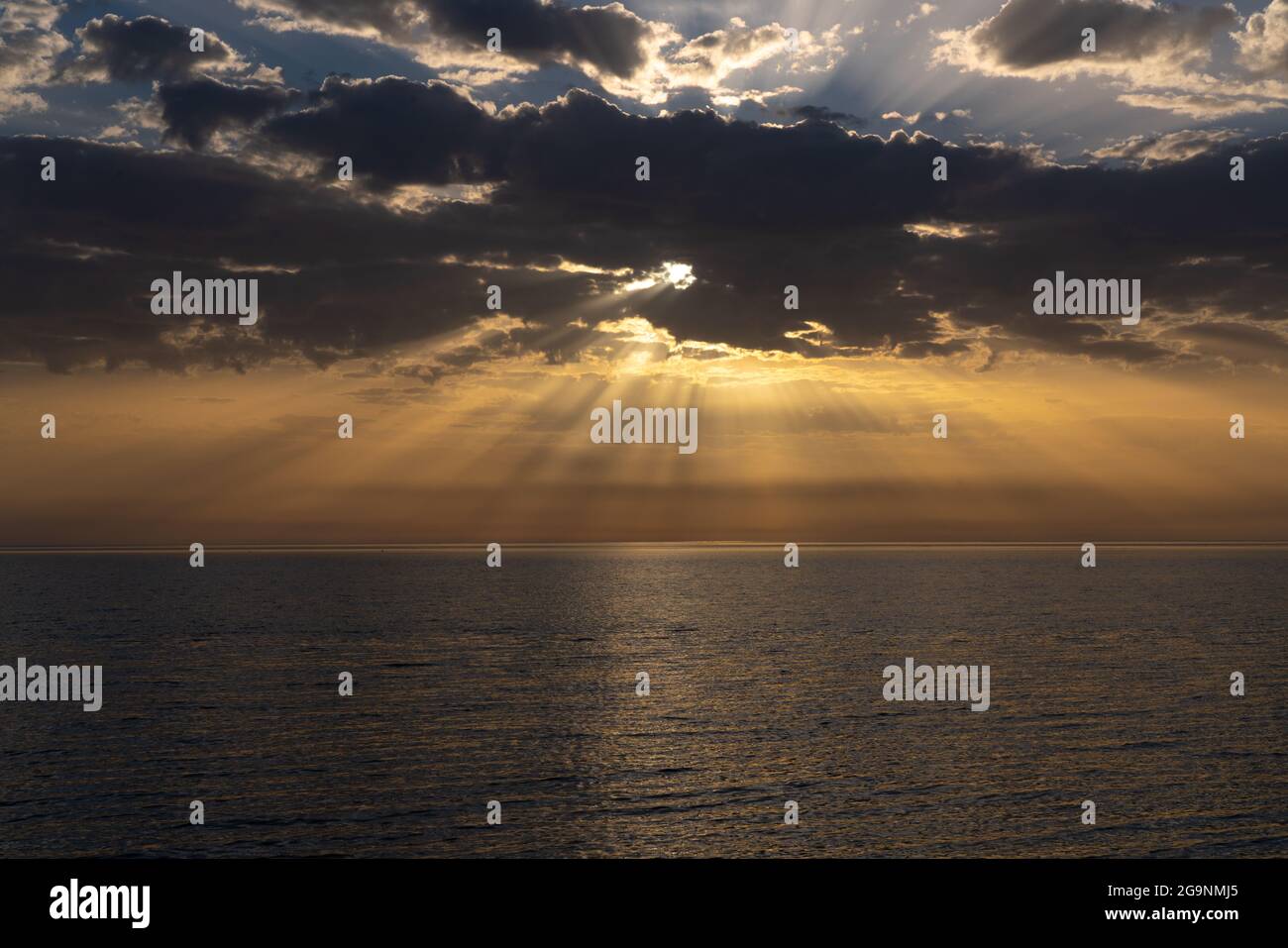 magnificent sunset on the sea, sun rays Stock Photo - Alamy