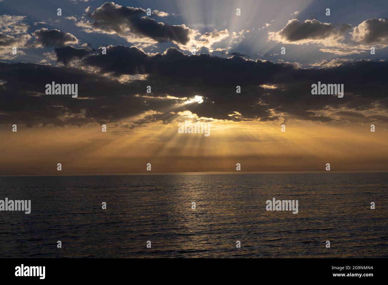 magnificent sunset on the sea, sun rays Stock Photo - Alamy
