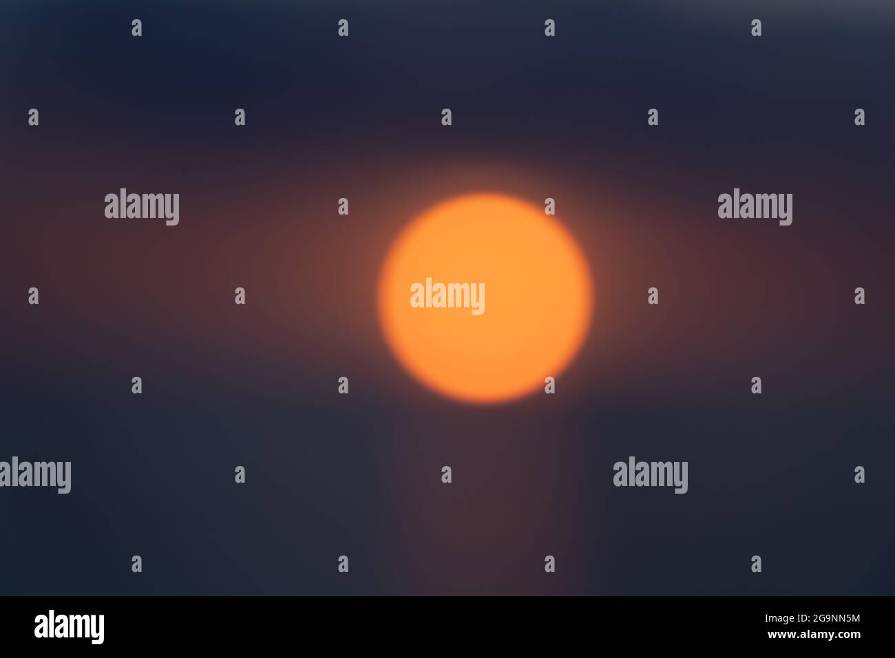 orange sun out of focus at sunset Stock Photo - Alamy