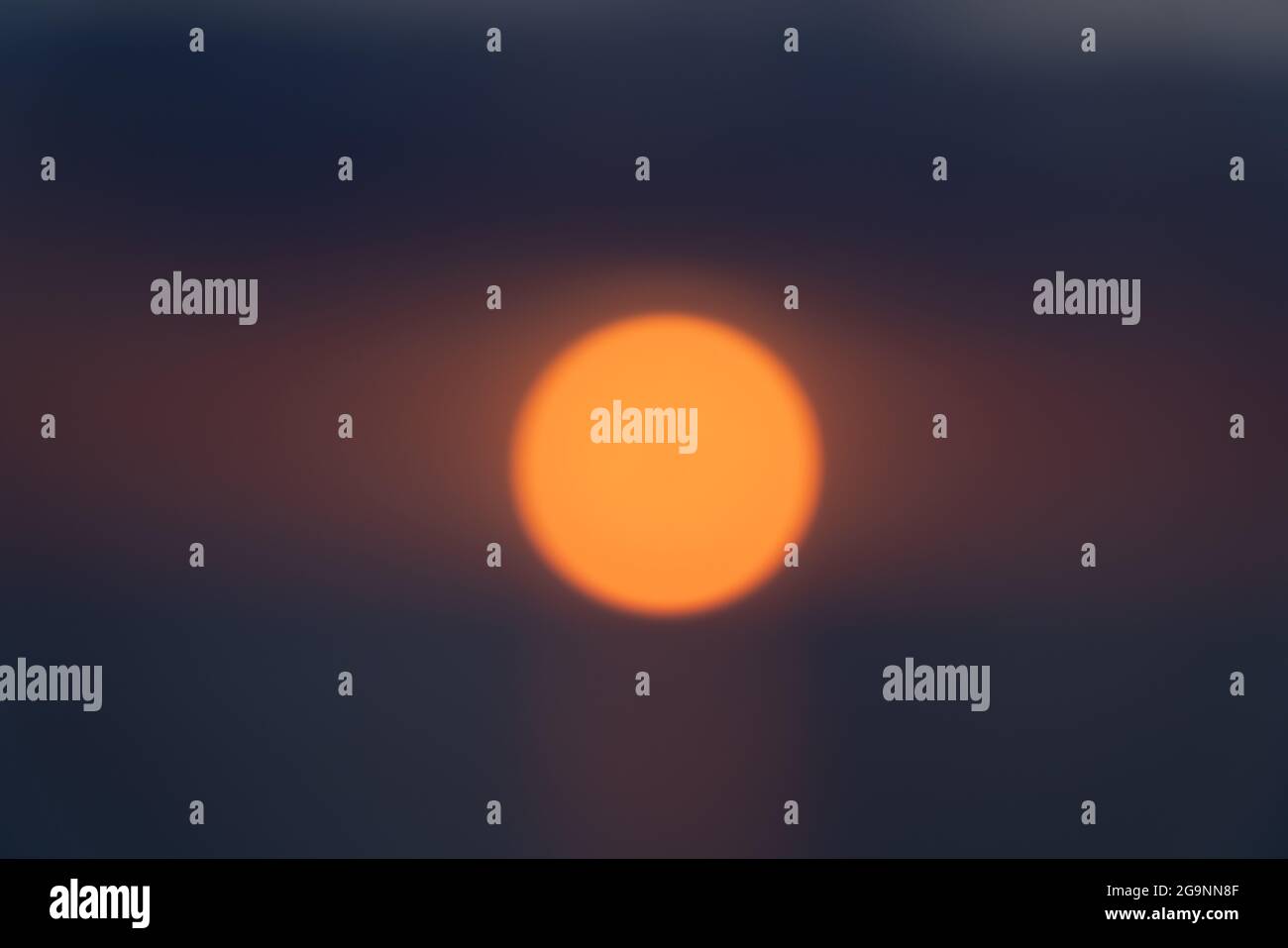 orange sun out of focus at sunset Stock Photo - Alamy